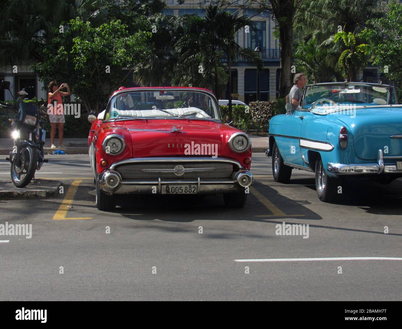 American convertible vintage cars parked on the main street in Cuba ...