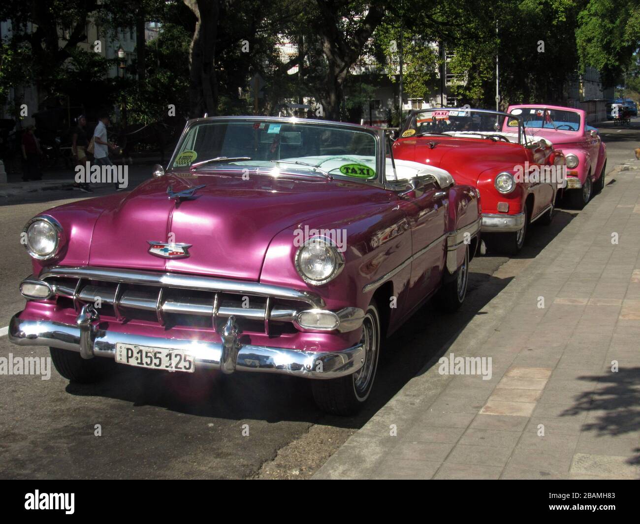 American convertible vintage cars parked on the main street in Cuba ...