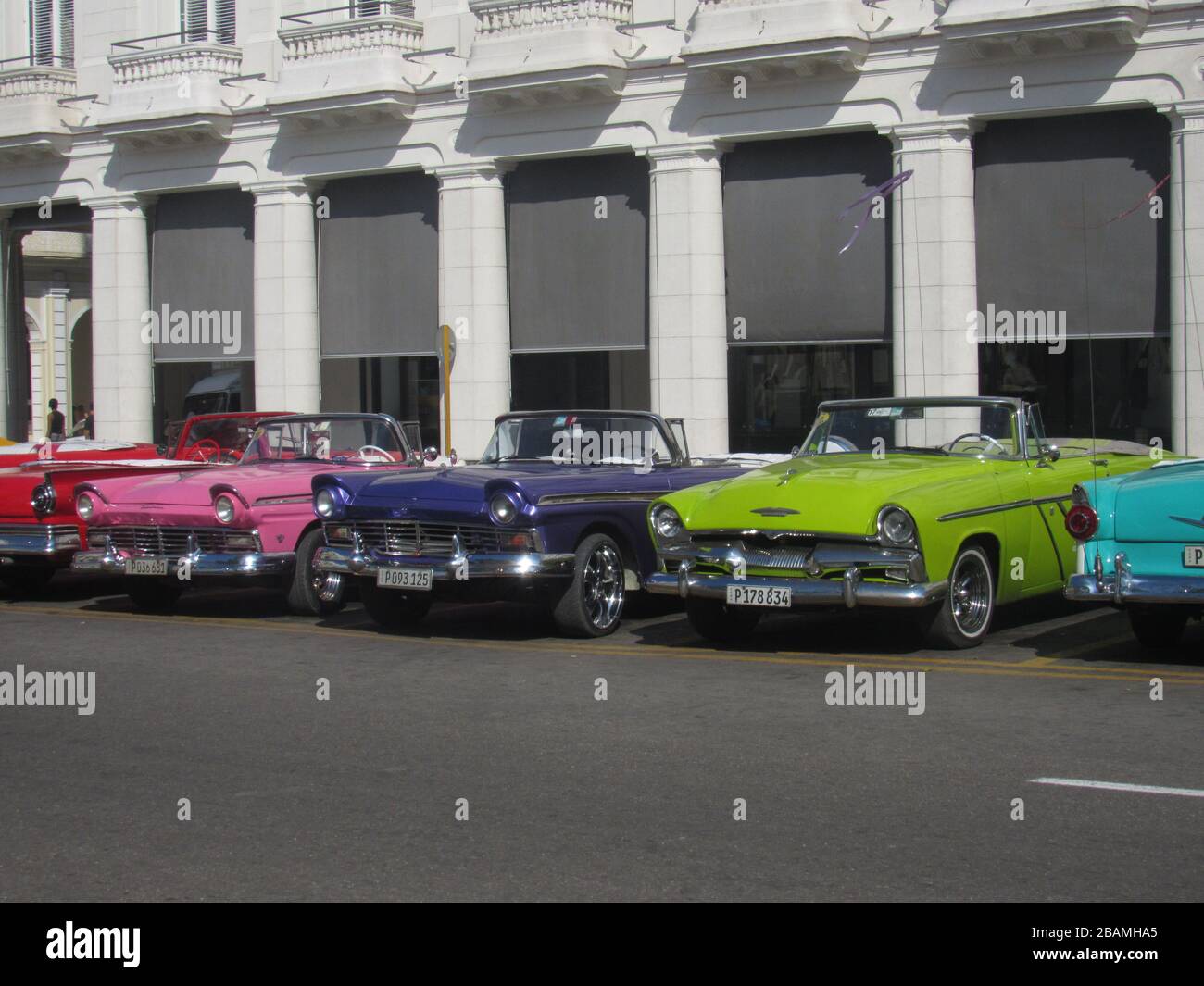 American convertible vintage cars parked on the main street in Cuba ...