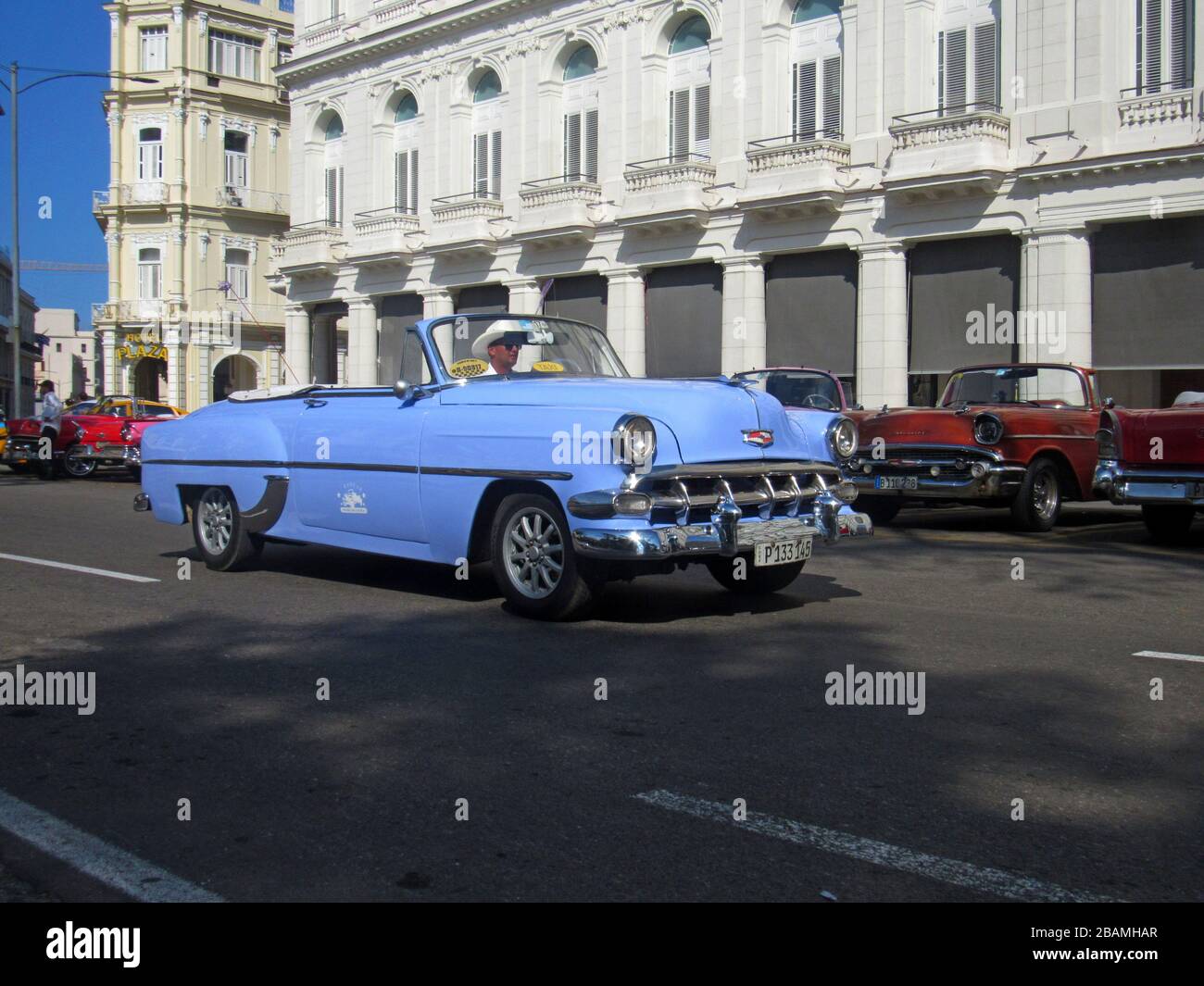 American convertible vintage cars parked on the main street in Cuba ...