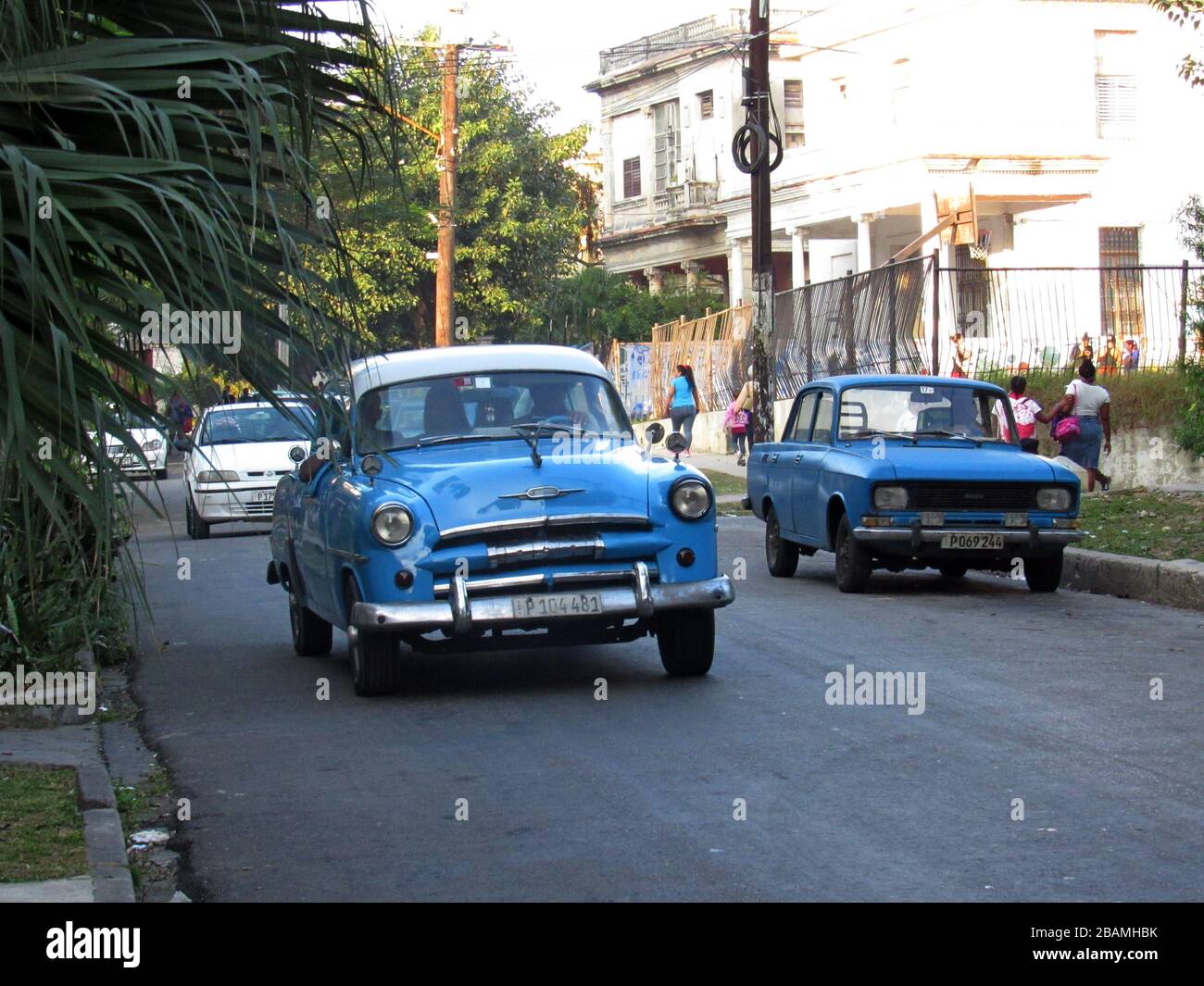 American convertible vintage cars parked on the main street in Cuba ...