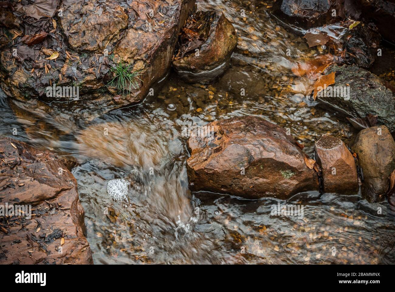Water splashing over river rocks Stock Photo - Alamy