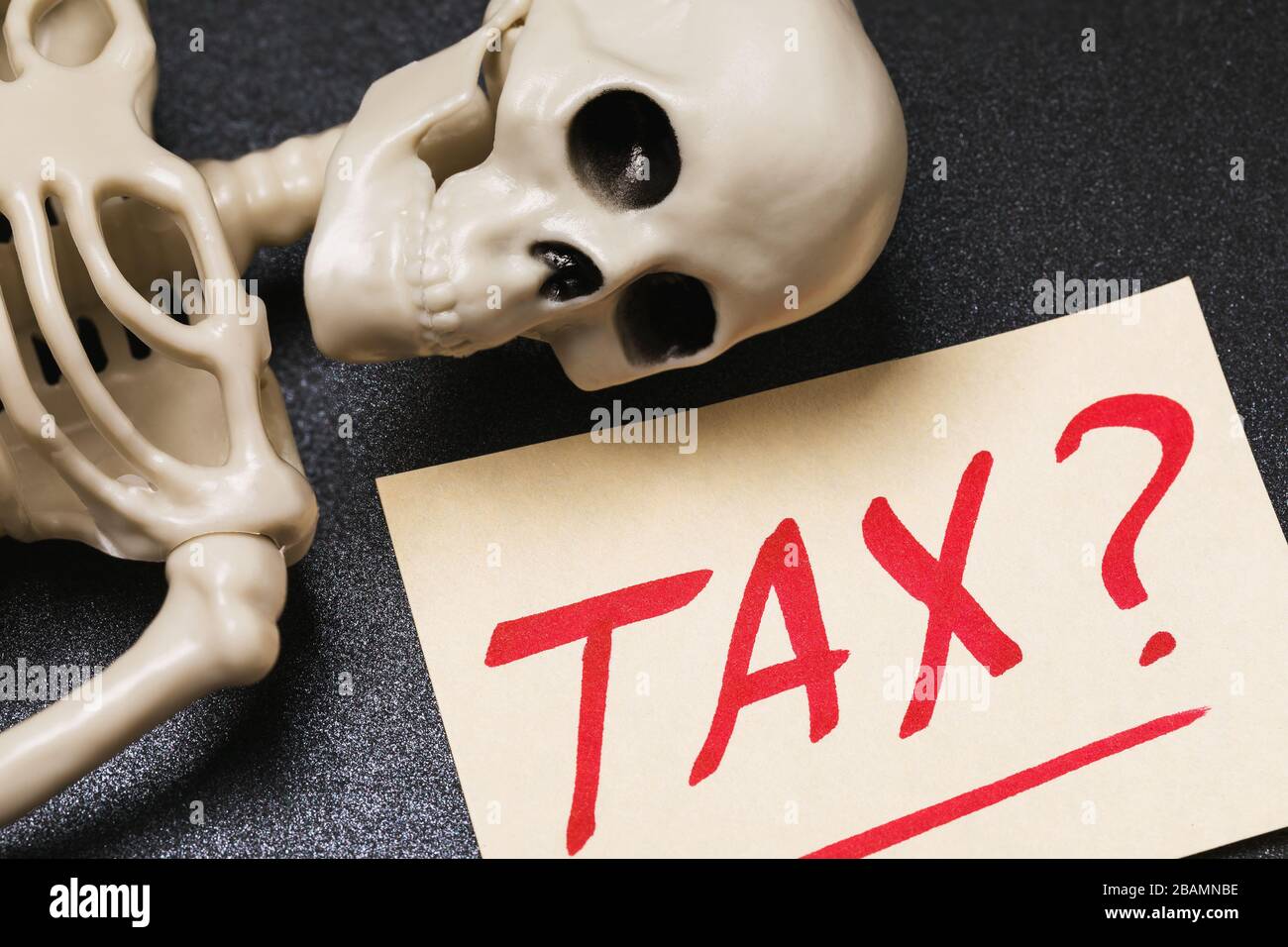 Skeleton and tag with text. The concept of large taxes for the ...