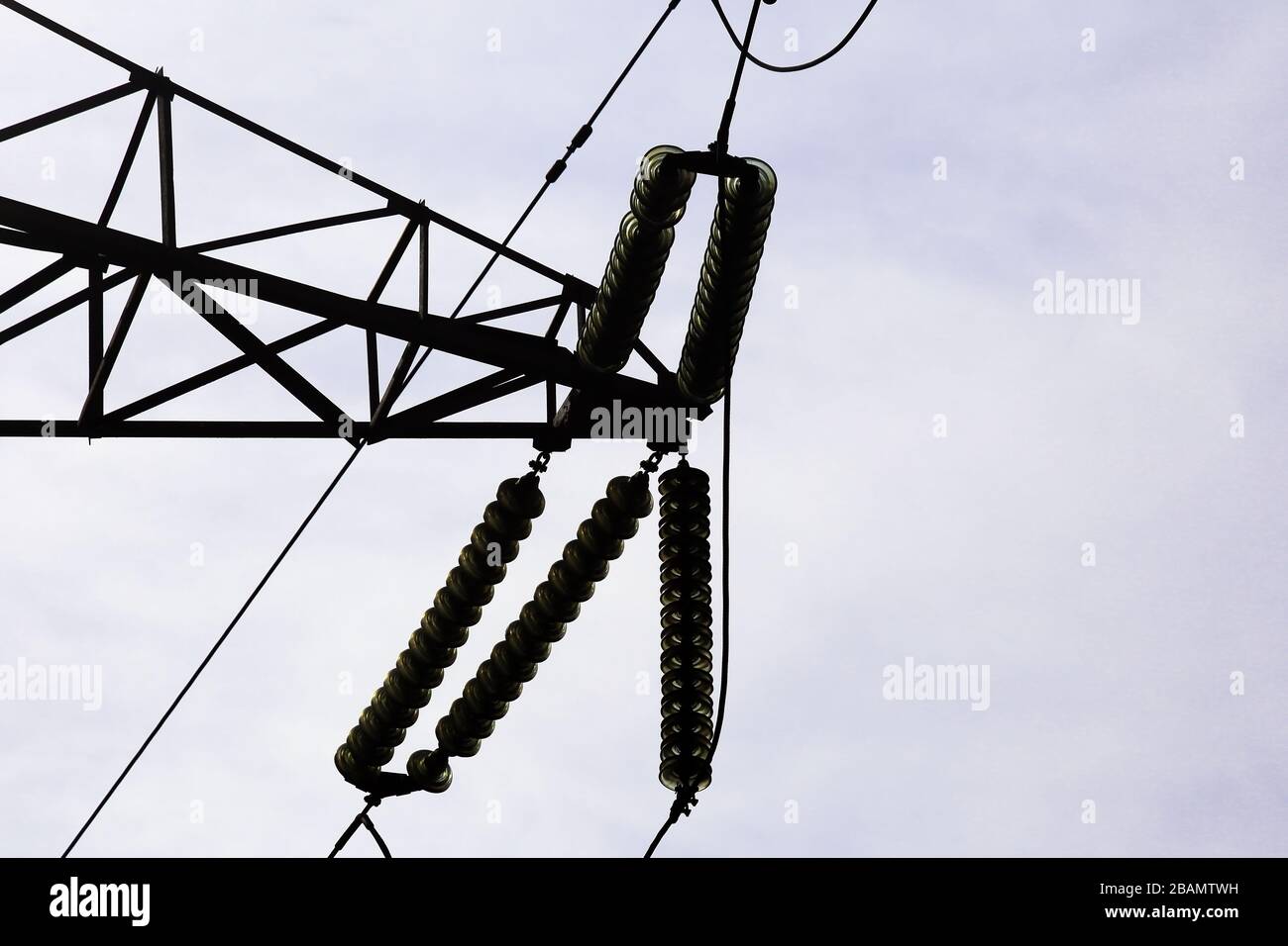 insulator on a pole of high voltage power lines clos-up Stock Photo - Alamy
