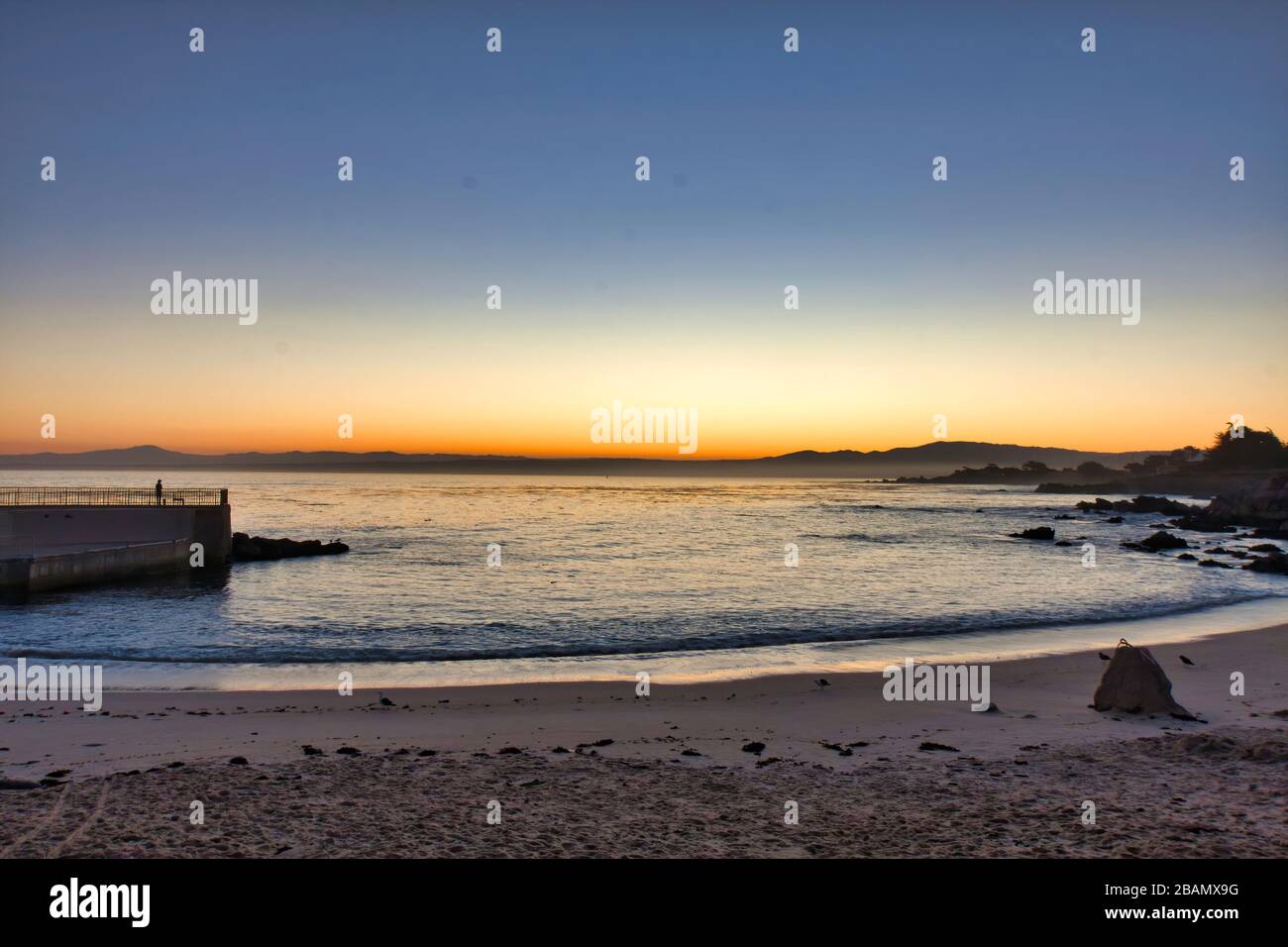Sunrise view of Pacific Grove beach and pier Stock Photo - Alamy