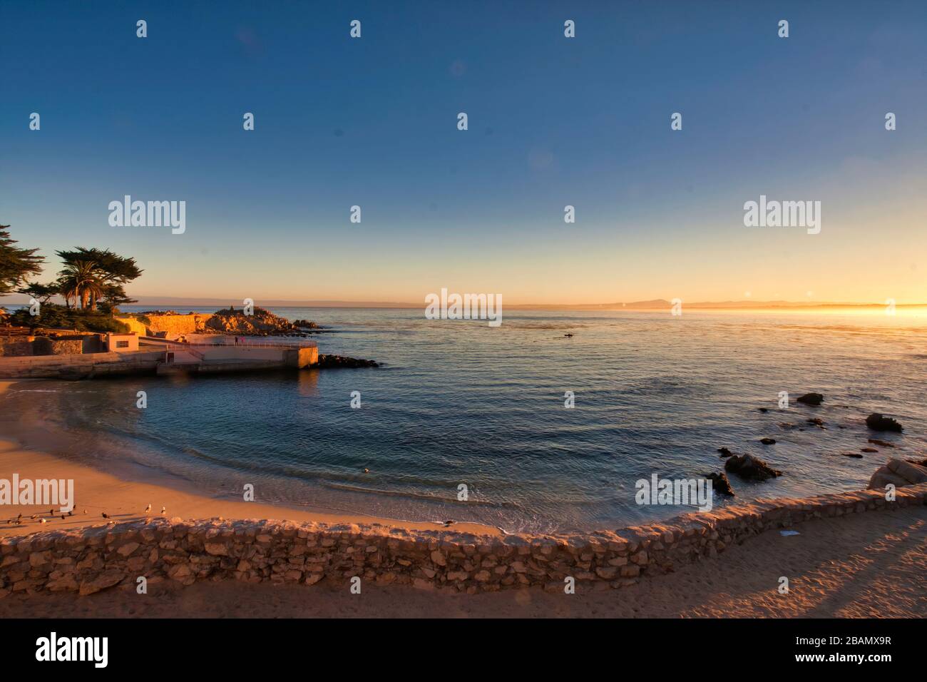 Sunrise view of Pacific Grove beach and pier Stock Photo - Alamy