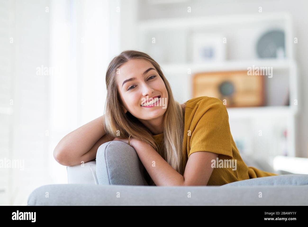 Portrait of a woman relaxing at home Stock Photo - Alamy