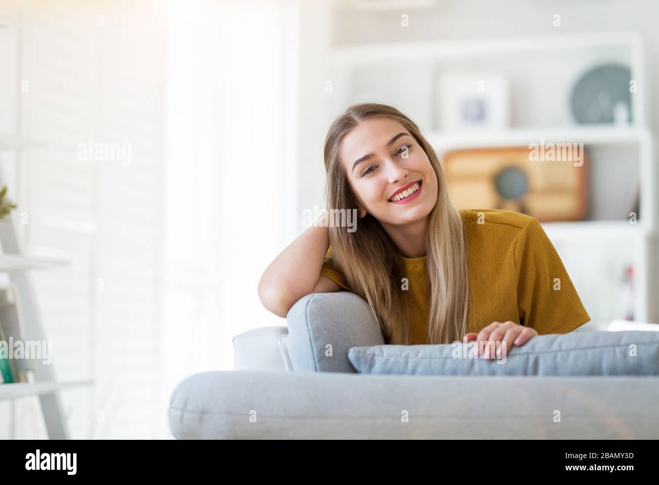 Portrait of a woman relaxing at home Stock Photo - Alamy