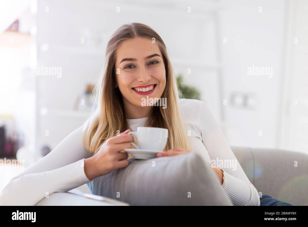 Portrait of a woman relaxing at home Stock Photo - Alamy