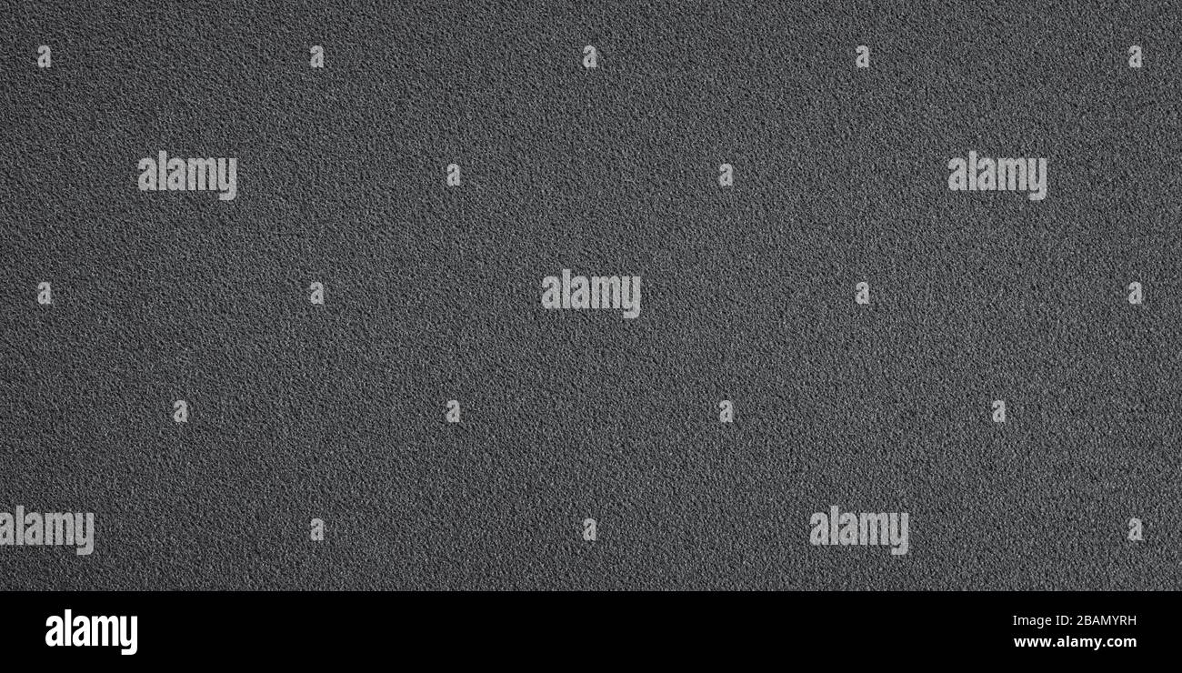 Long black metallic textured plate close up. Texture and background ...