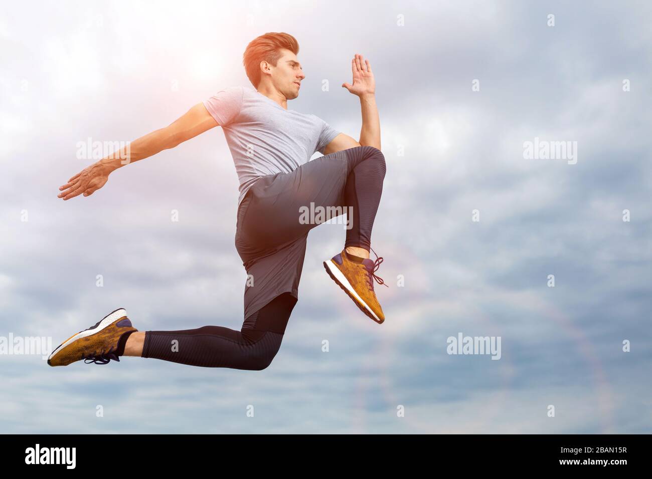 Young man running in gym hi-res stock photography and images - Alamy