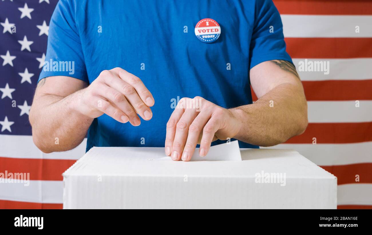 Persons Hand with ballot and voting box on Flag of USA Stock Photo - Alamy