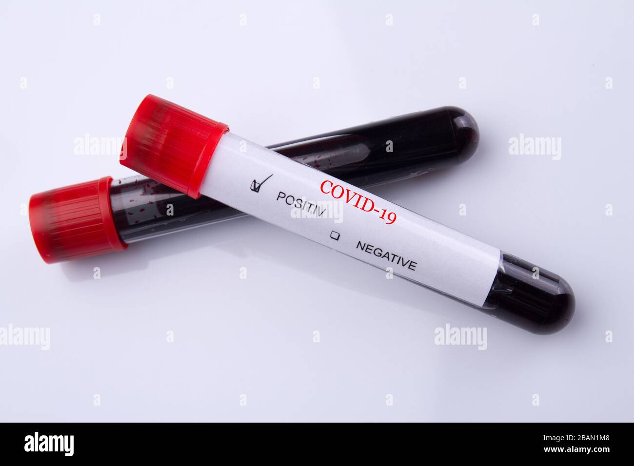 Two blood test tubes on white background Stock Photo - Alamy