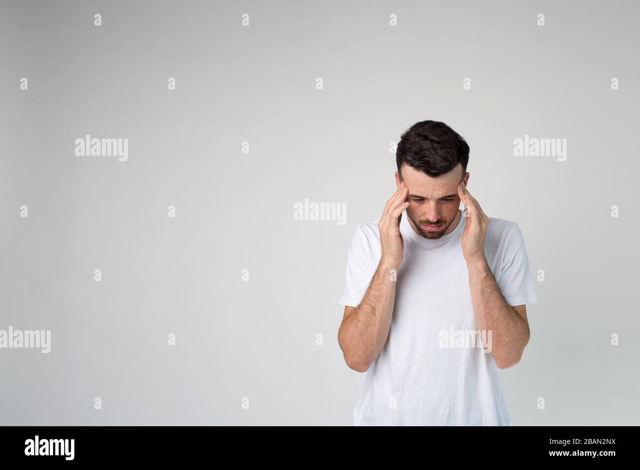 Handsome guy in thinking pose hi-res stock photography and images - Alamy