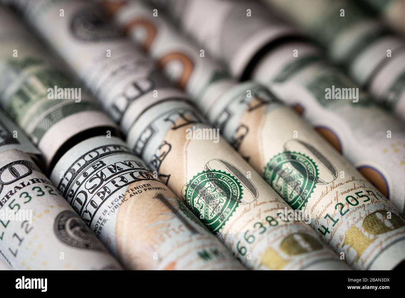 Rolls of US dollar bill in a row Stock Photo - Alamy
