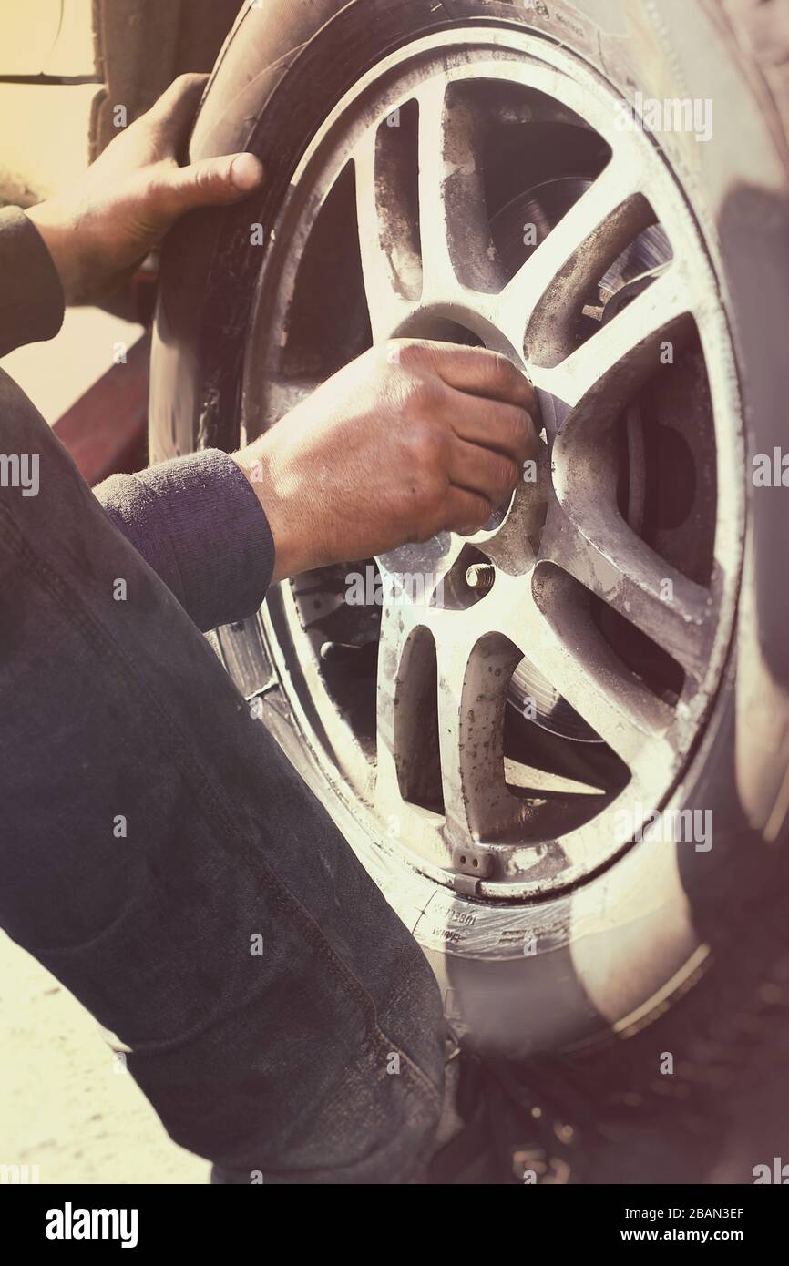Close up view on wheel repair process vertical Stock Photo - Alamy