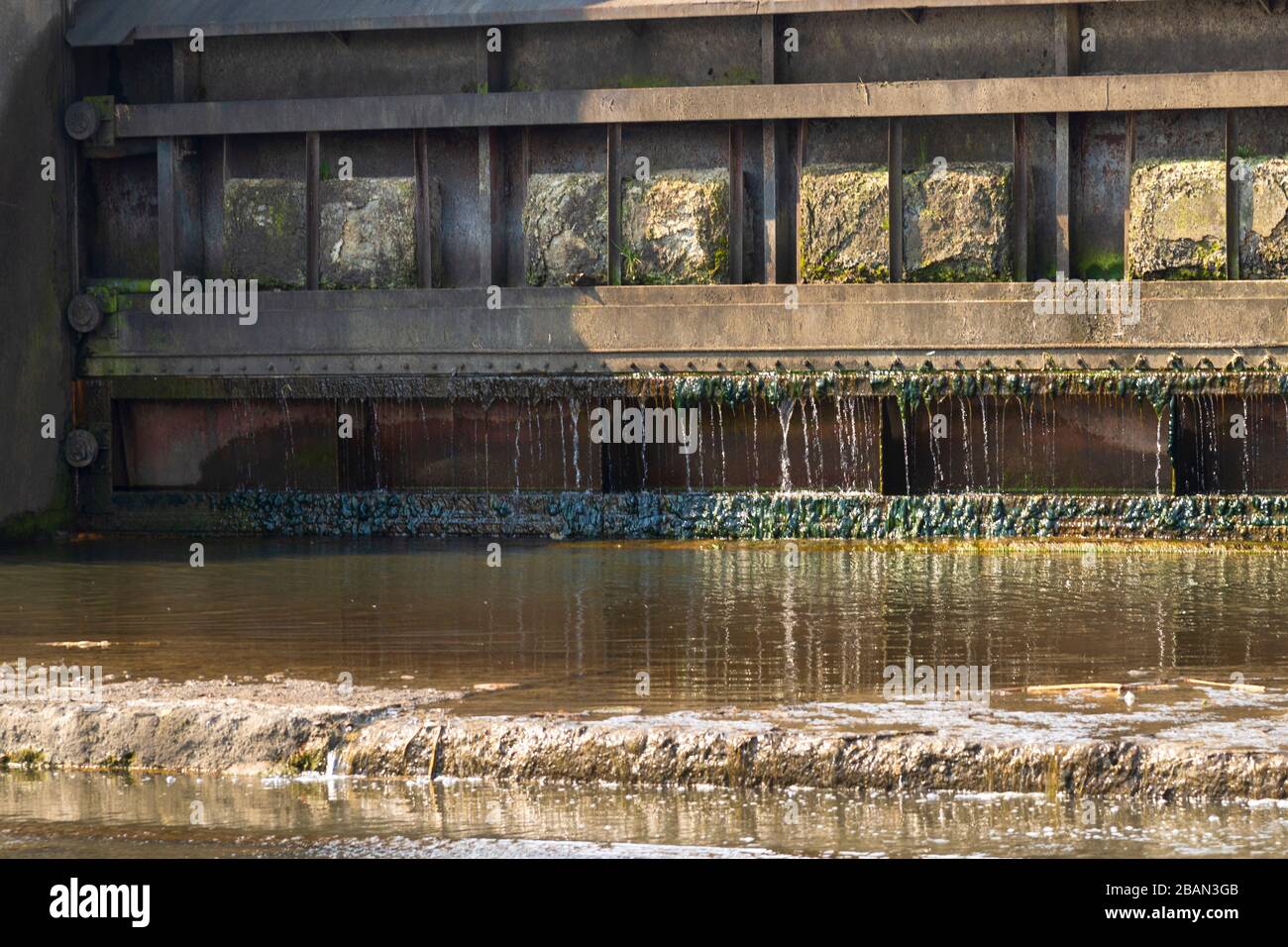 A small dam in a city river in a European city, to adjust the water ...