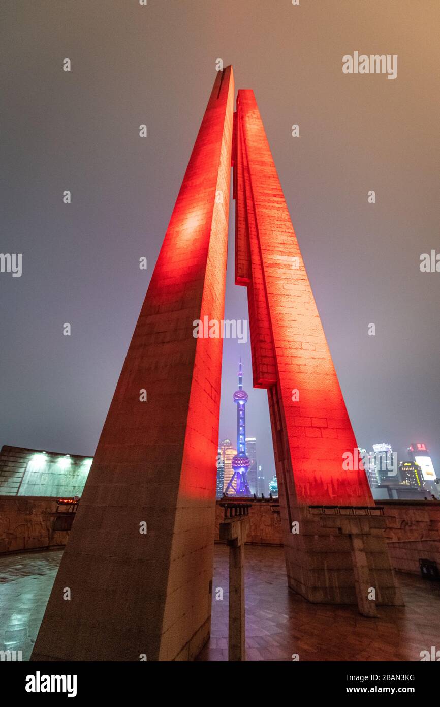 The Oriental Pearl TV Tower framed by the Monument to the People's ...