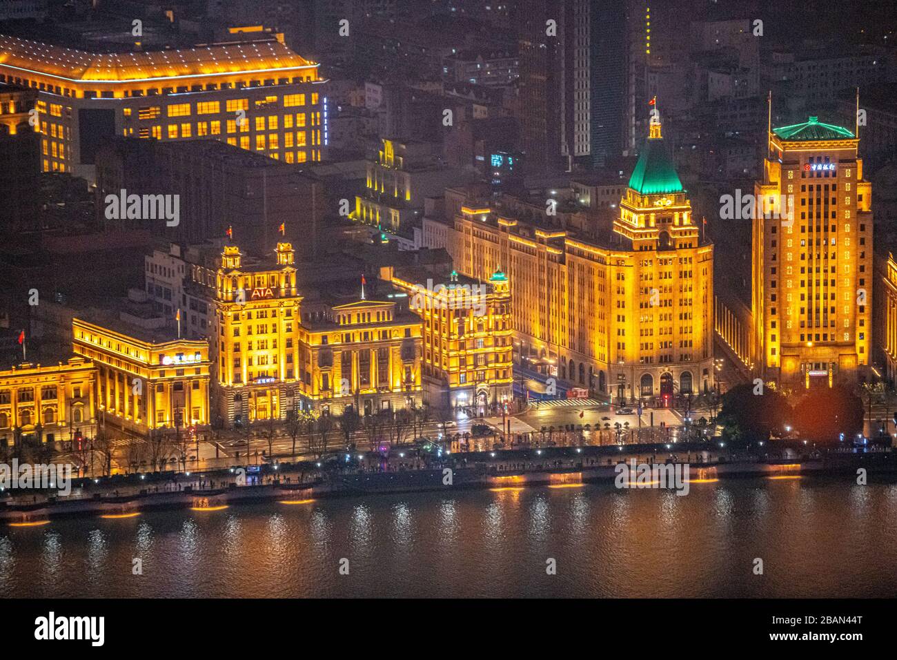 The bright lights from the Bund illuminating the surrounding area ...