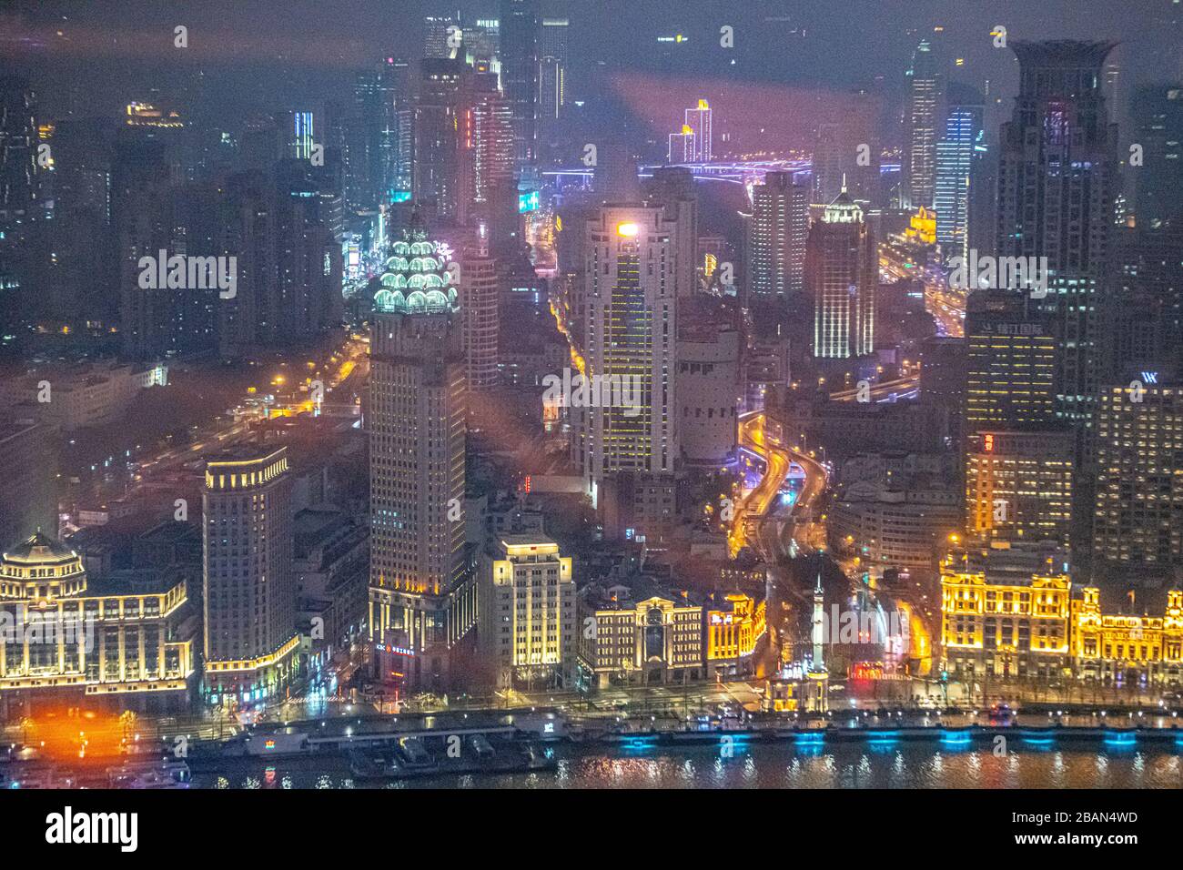 The bright lights from the Bund illuminating the surrounding area ...