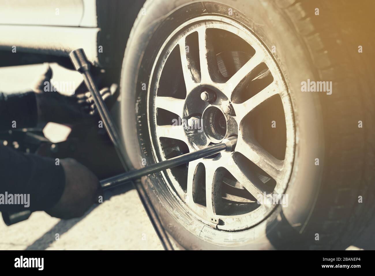 Wheel nuts tighttening process by a wheel wrench Stock Photo - Alamy