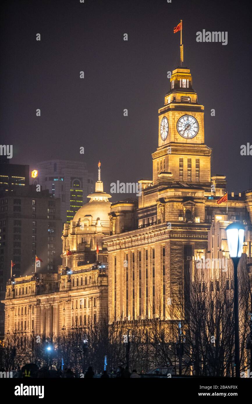 The bright lights from the Bund illuminating the surrounding area ...