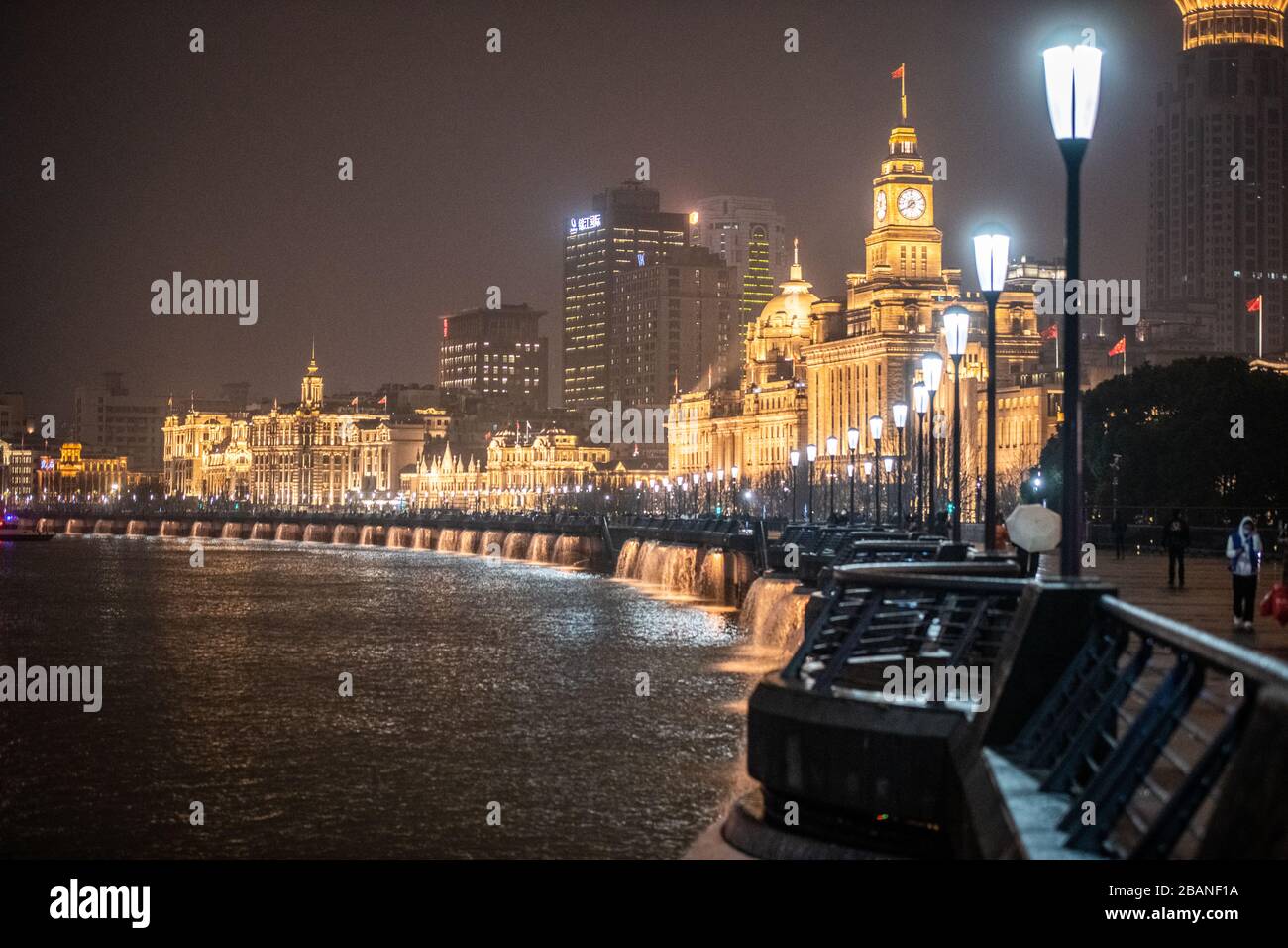 The bright lights from the Bund illuminating the surrounding area ...