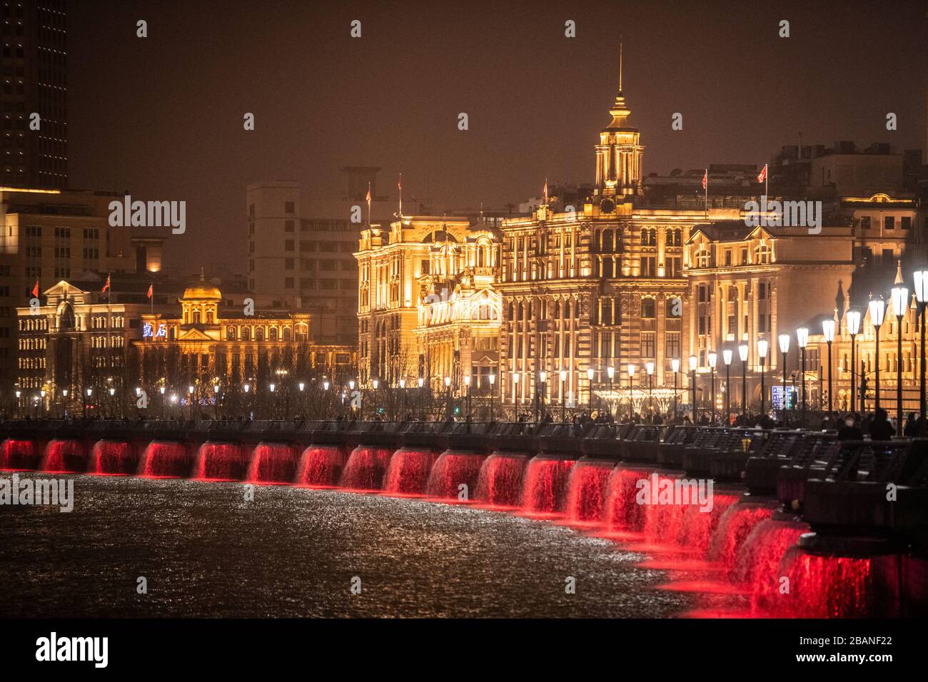 Color changing lights on the water backed by the bright glow of the ...