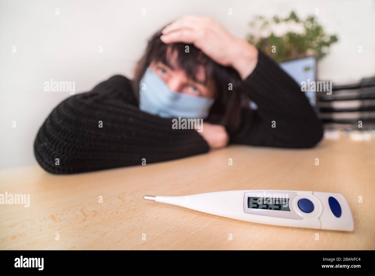 Coronavirus disease. Sick woman with face mask. High temperature on ...