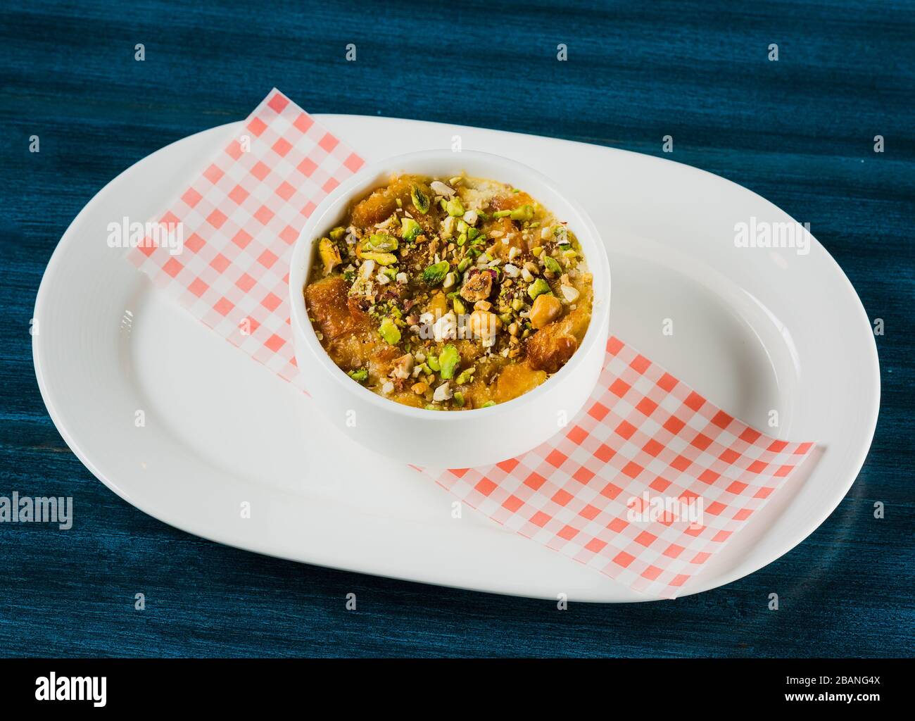 Turkish dessert kunefe, kunafa, kadayif with pistachio powder and ...