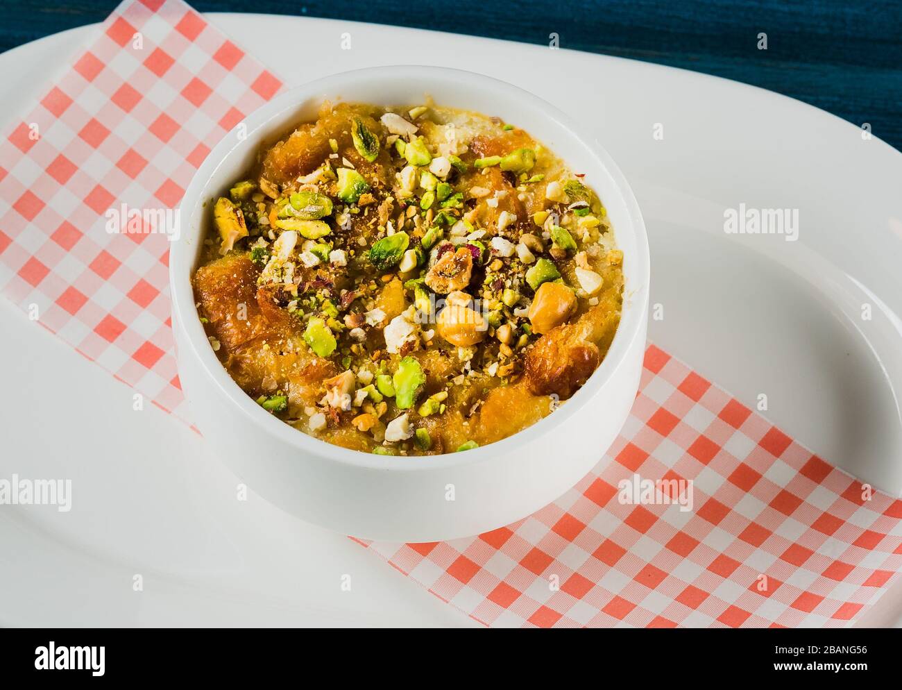 Turkish dessert kunefe, kunafa, kadayif with pistachio powder and ...