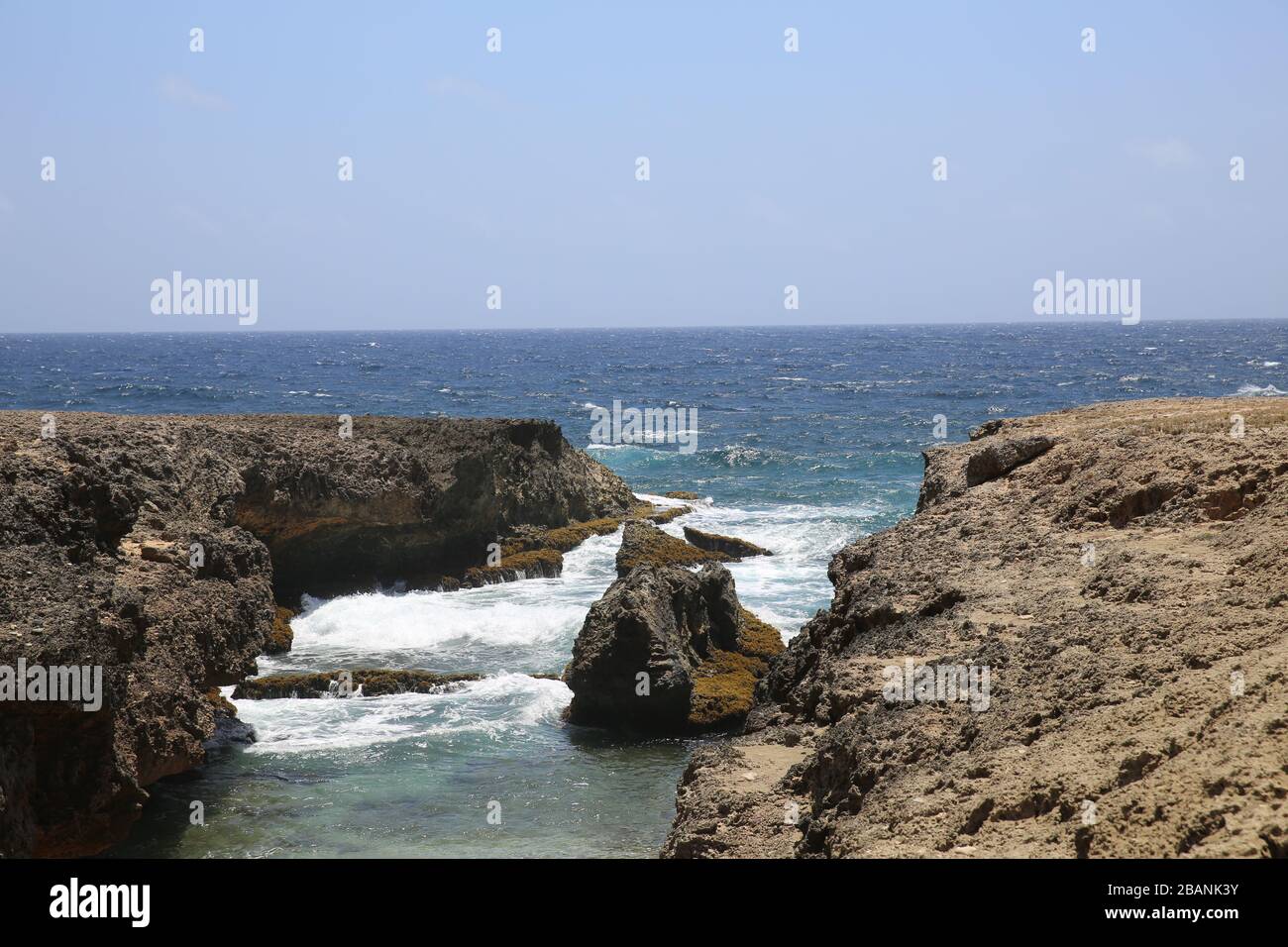 Eastern shoreline with volcanic rocks and crushing waves in Aruba Stock ...