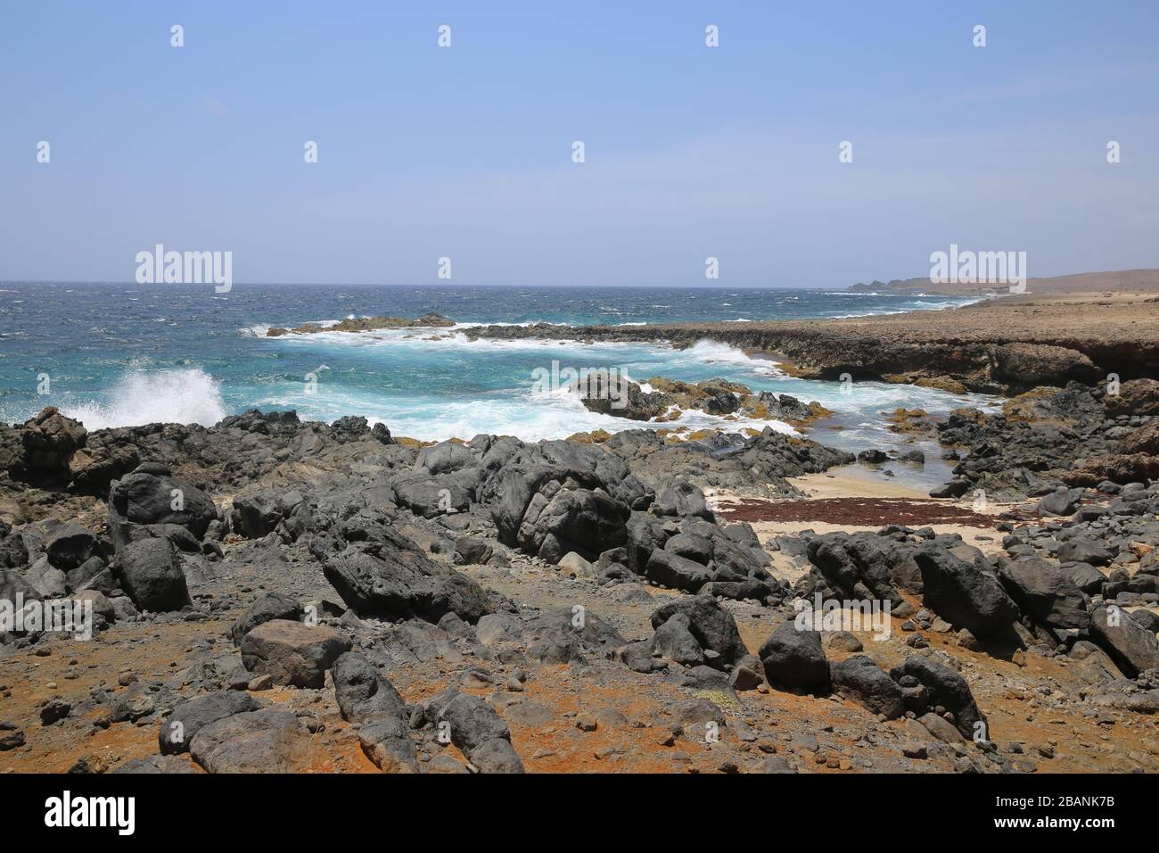Eastern shoreline with volcanic rocks and crushing waves in Aruba Stock ...