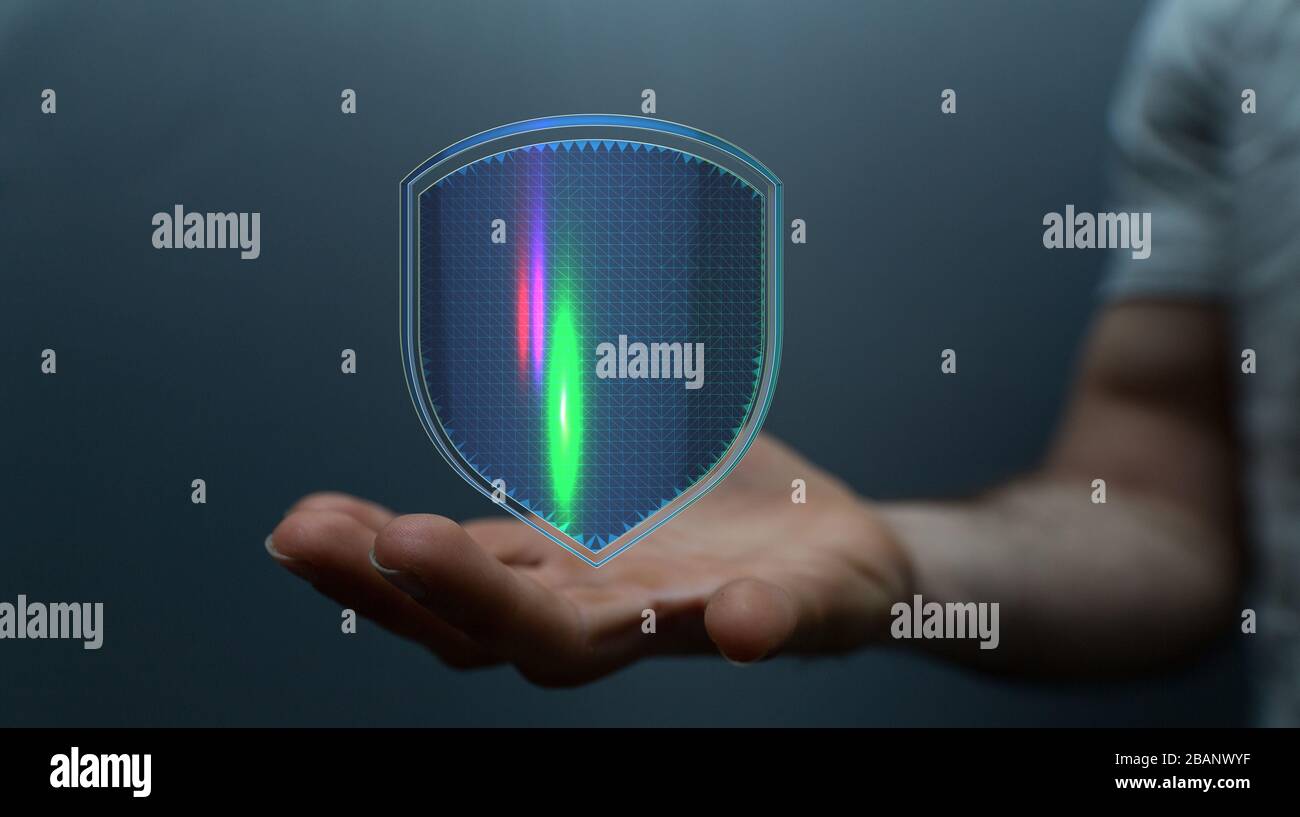 A shield protection concept holding in hand Stock Photo - Alamy