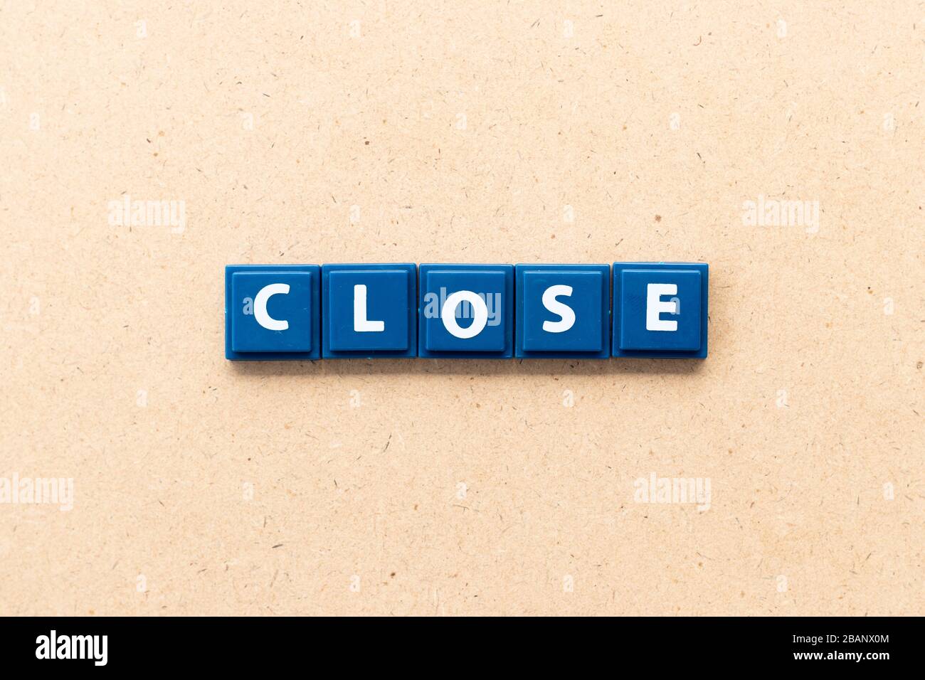 Tile letter in word close on wood background Stock Photo - Alamy