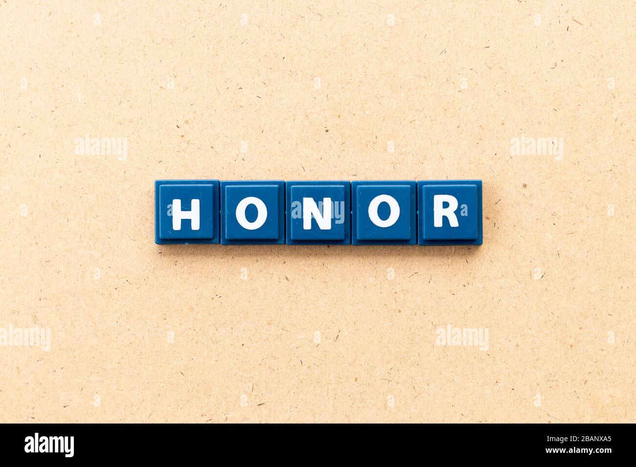 Tile letter in word honor on wood background Stock Photo - Alamy