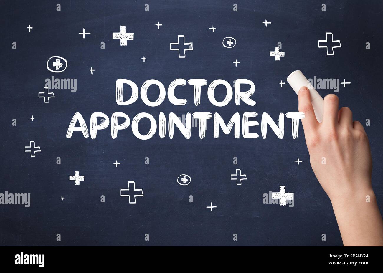 Hand drawing DOCTOR APPOINTMENT inscription with white chalk on ...
