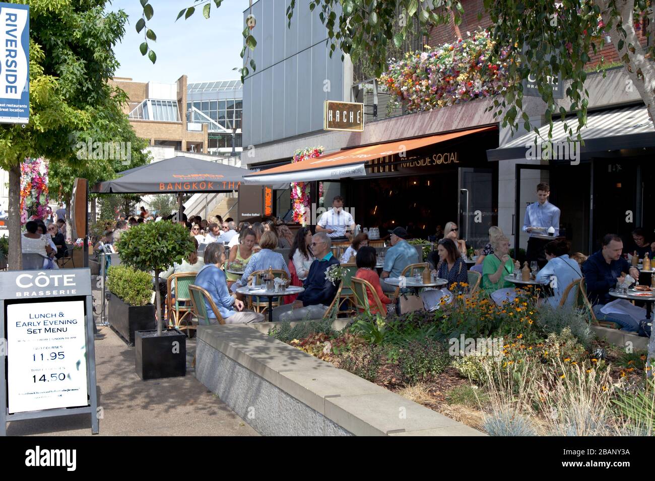 Numerous cafes offer outdoor dining along the Thames Riverside Quay in ...