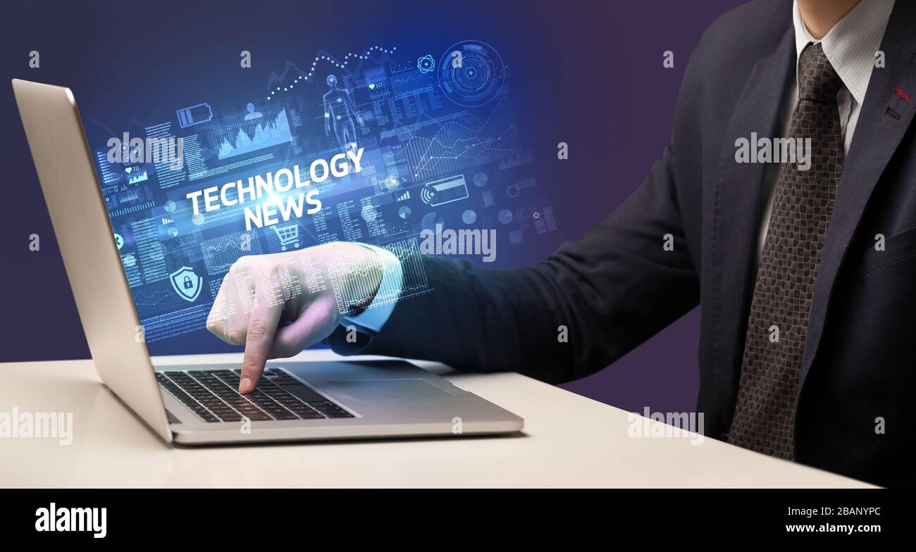 Businessman working on laptop with TECHNOLOGY NEWS inscription, cyber ...