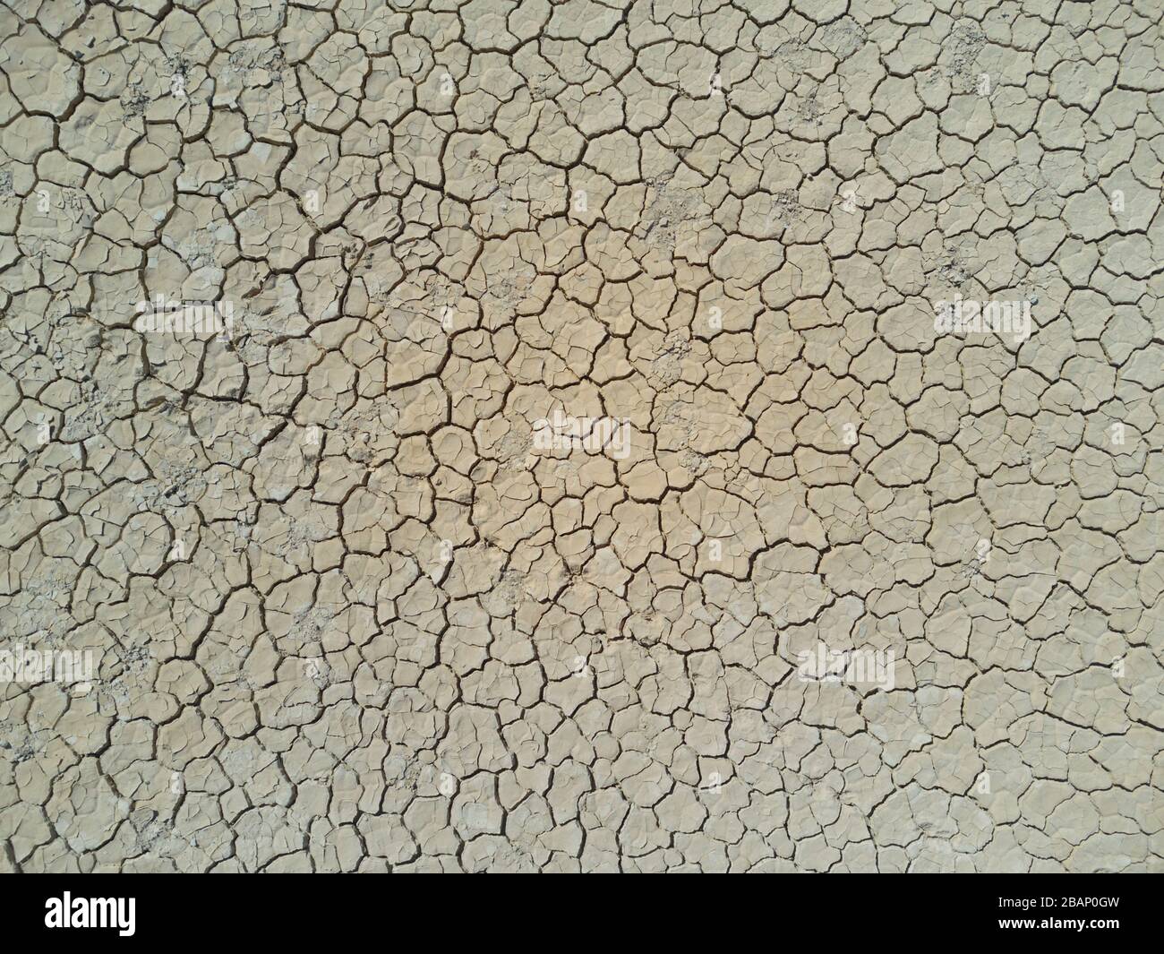 Cracked earth mud after all the water has evaporated during an extended ...