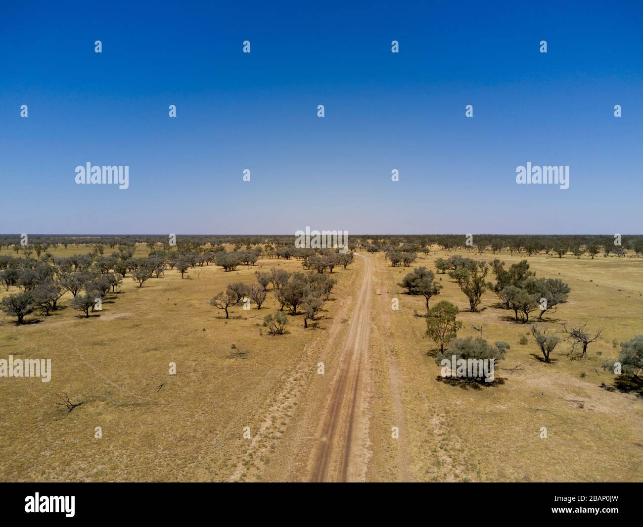 Aerial of unsealed road passing through Bulloo River flood plain during ...