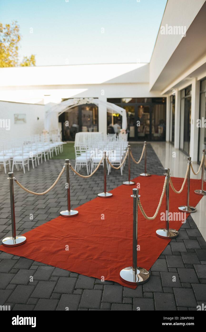Red carpet in front of restaurant entrance Stock Photo - Alamy