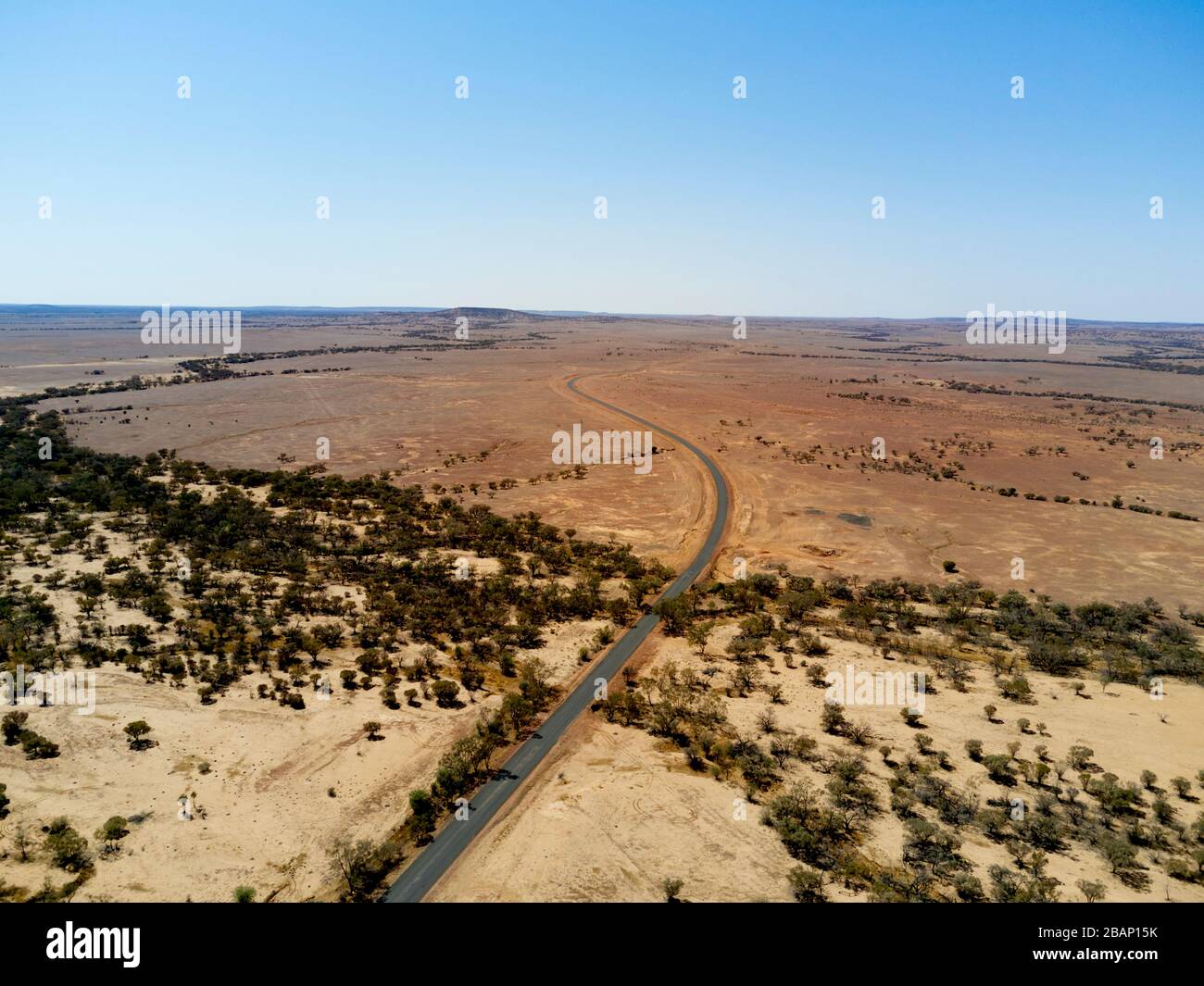 Aerial of Jackson Creek as it flows across the arid desert landscape ...