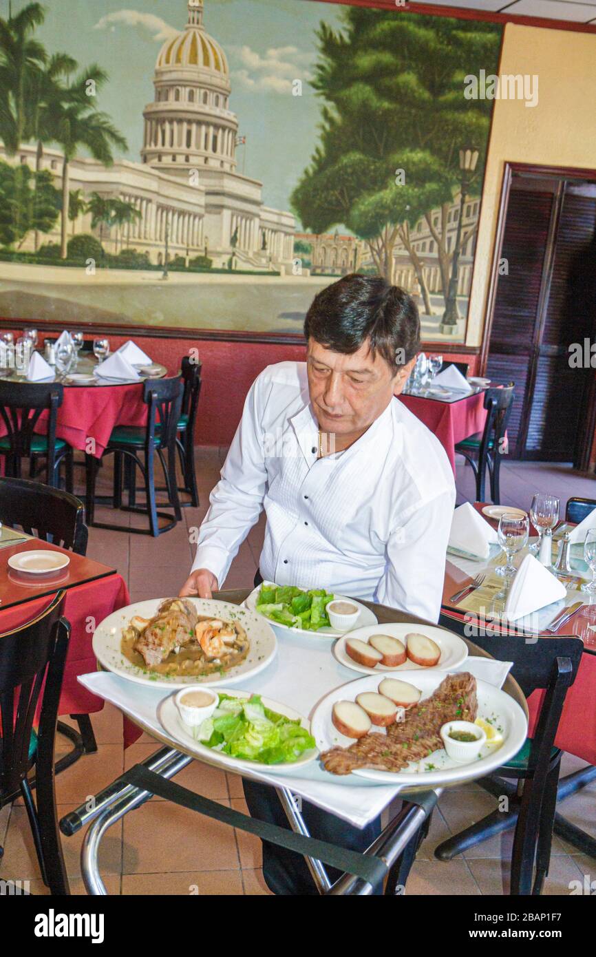Cuban waiter miami hi-res stock photography and images - Alamy