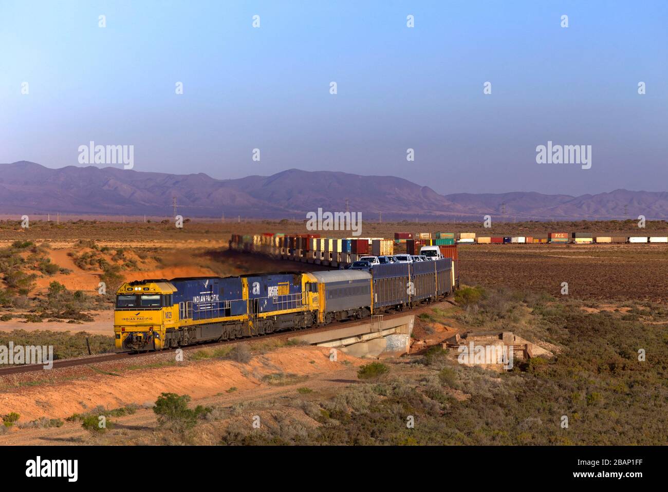 Freight train hauling double stacked modules - shipping containers ...