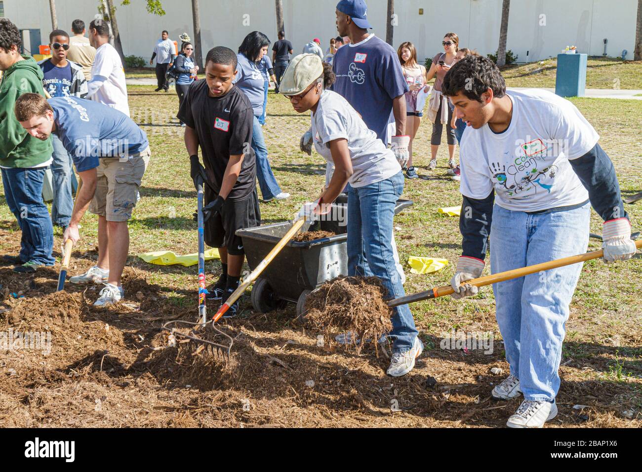 Hispanic male volunteers with black student hi-res stock photography ...