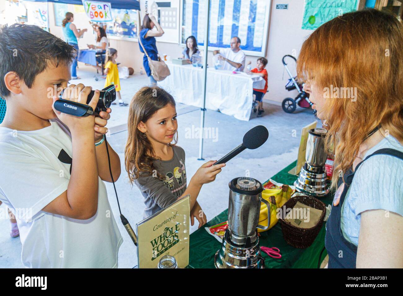 Female student holding microphone stand hi-res stock photography and ...