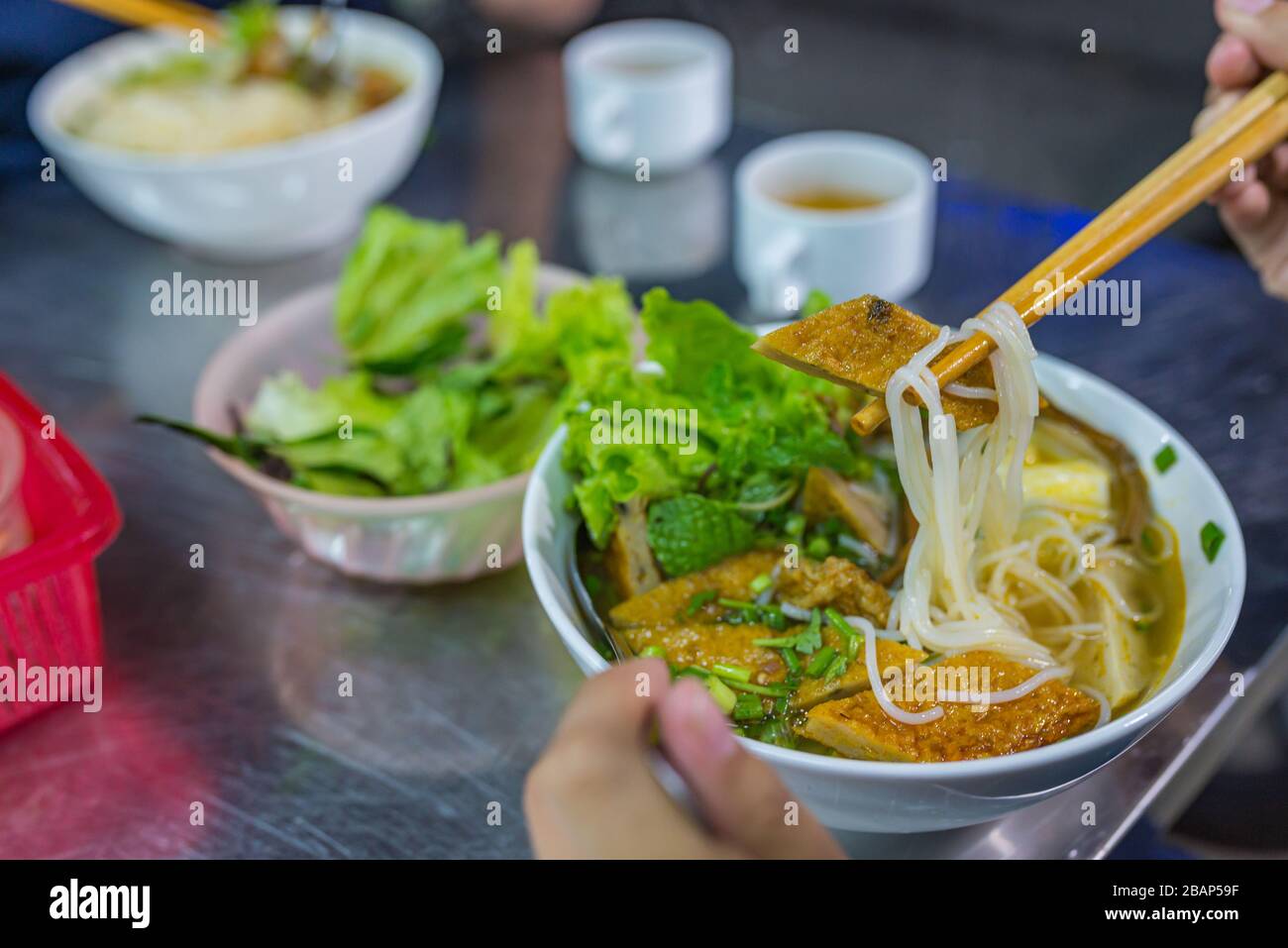 Vietnamese fried fish noodles served with vegetables- Bun Cha Ca Stock ...