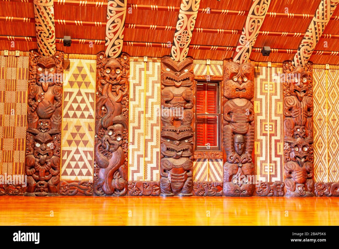 Traditional Maori carvings in the interior of Te Whare Runanga, the ...