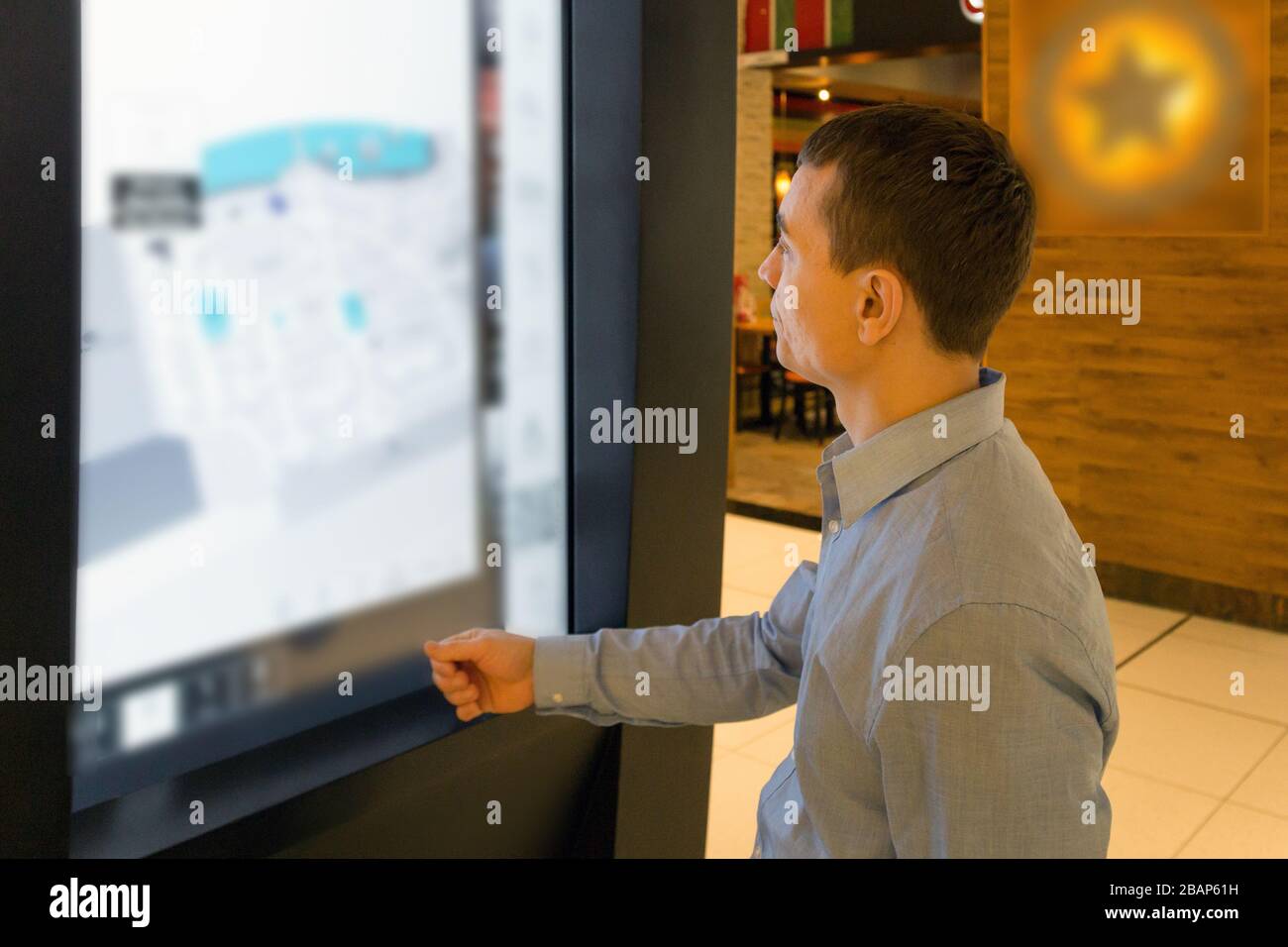 An adult male buyer of a large shopping center is looking for the right ...